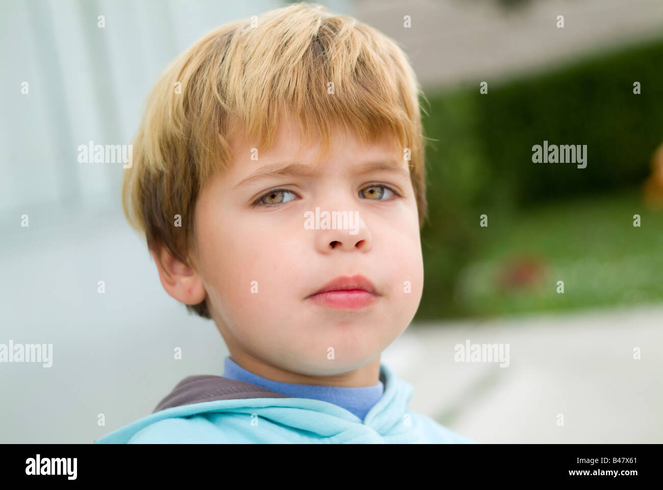 portrait of a boy with sad expression face Stock Photo - Alamy