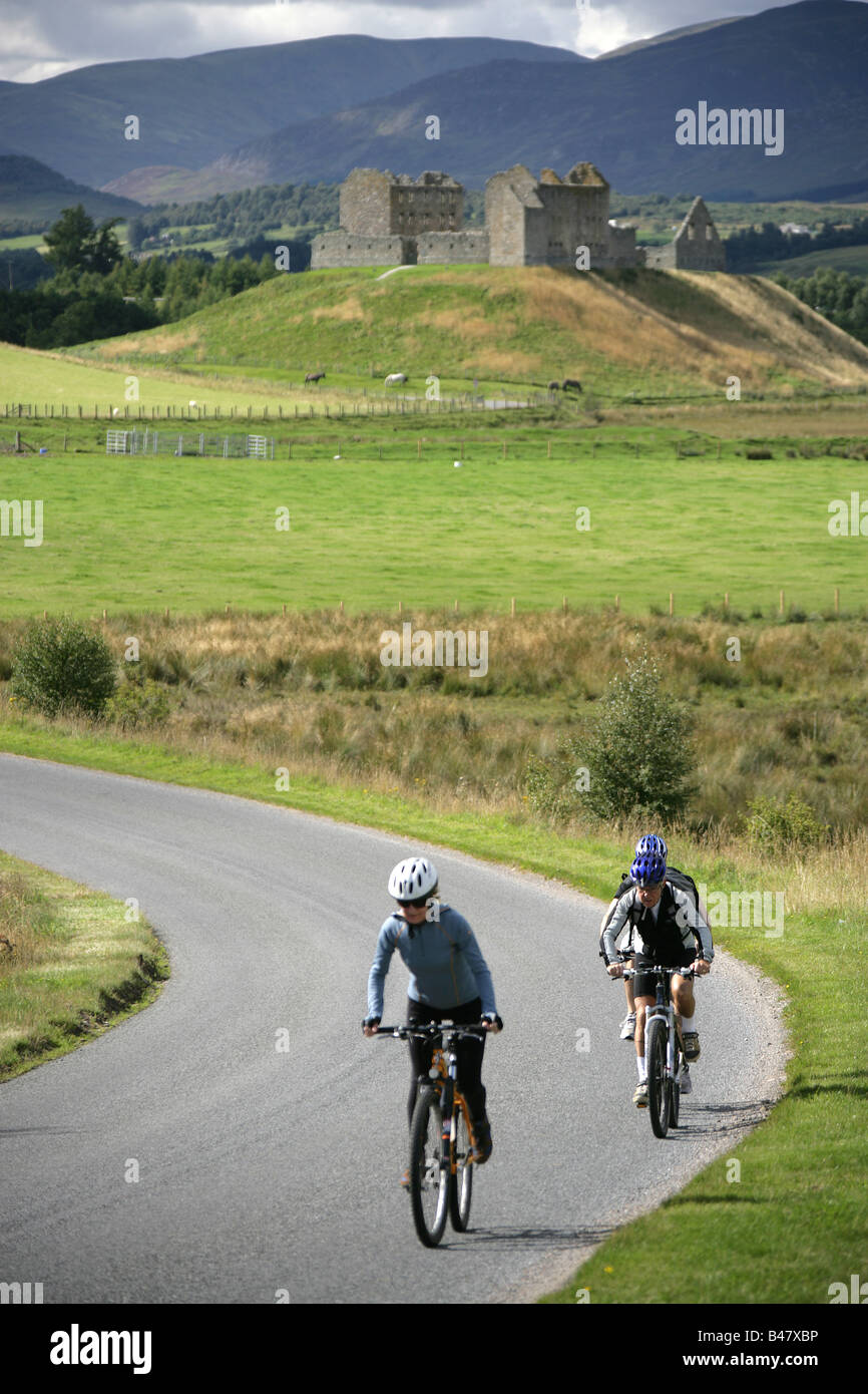 The Village of Kingussie, Scotland. Cyclists on the B970 heading north ...