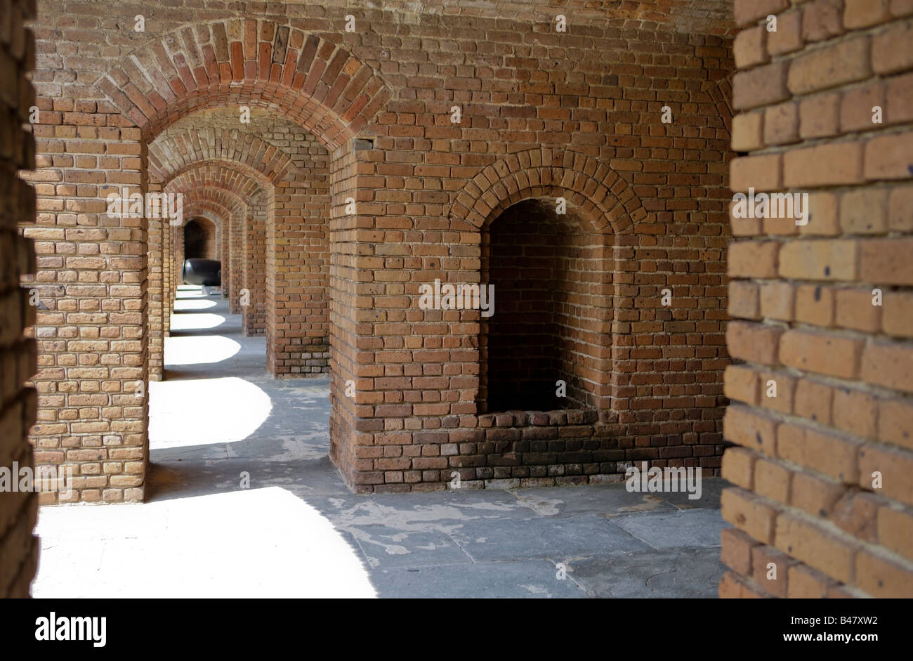 arched red brick corridor of artillery battery at Fort Taylor, Key West ...