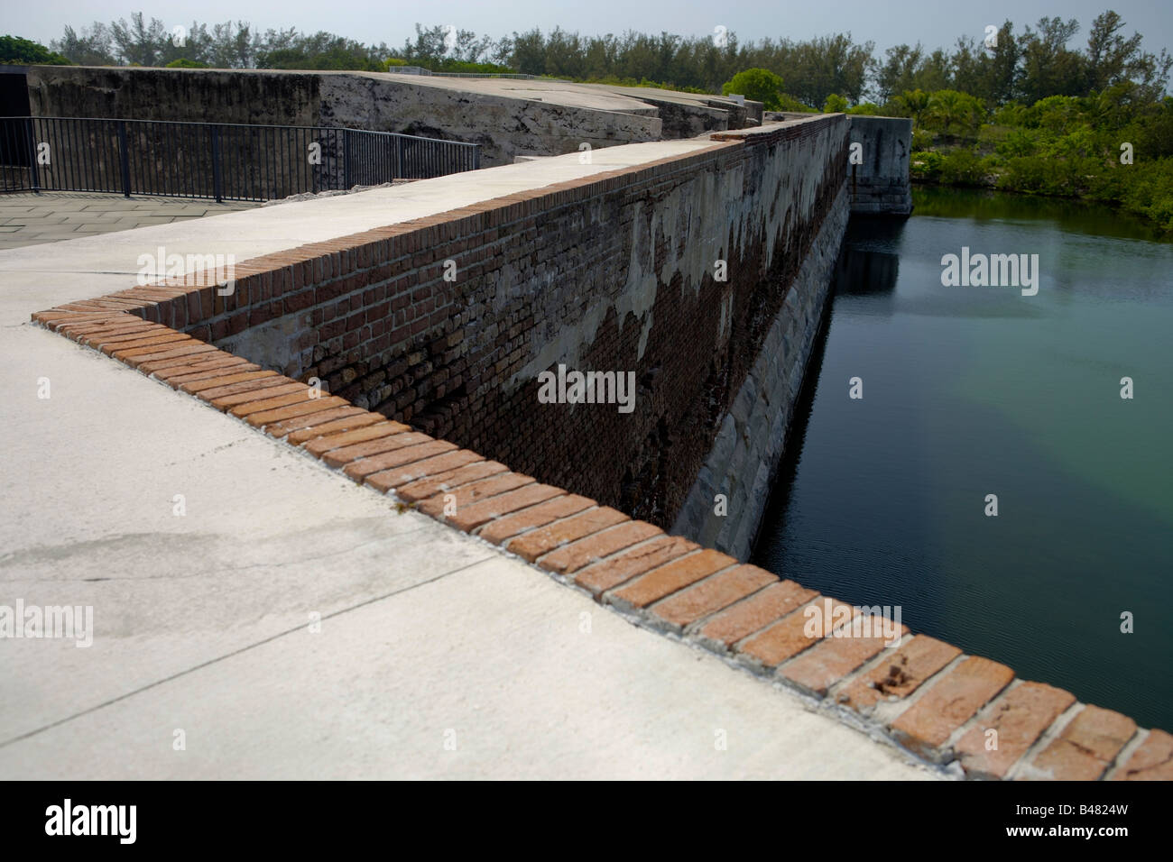Corner of fortress wall with lagoon moat at historic Fort Taylor Key ...