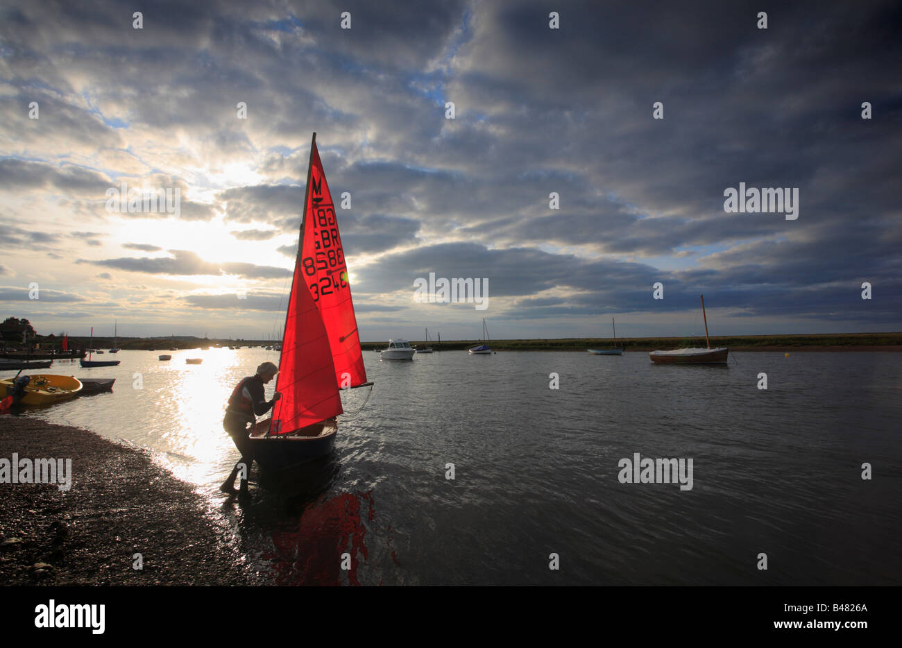 A senior female preparing her boat for a sail Stock Photo - Alamy