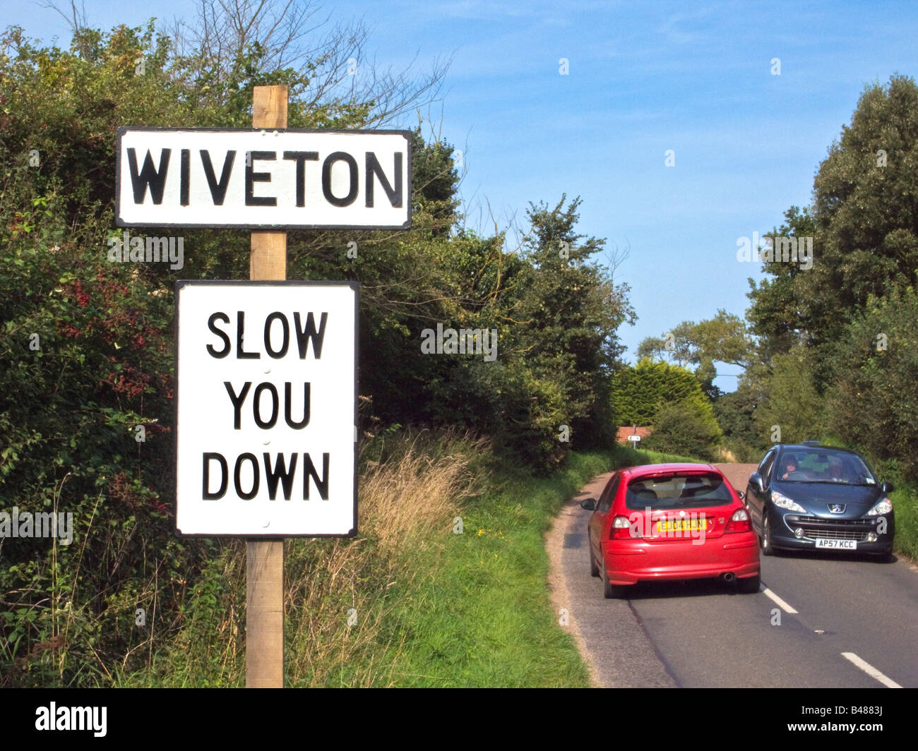 Amusing road sign SLOW YOU DOWN in Wiveton Norfolk East Anglia England ...