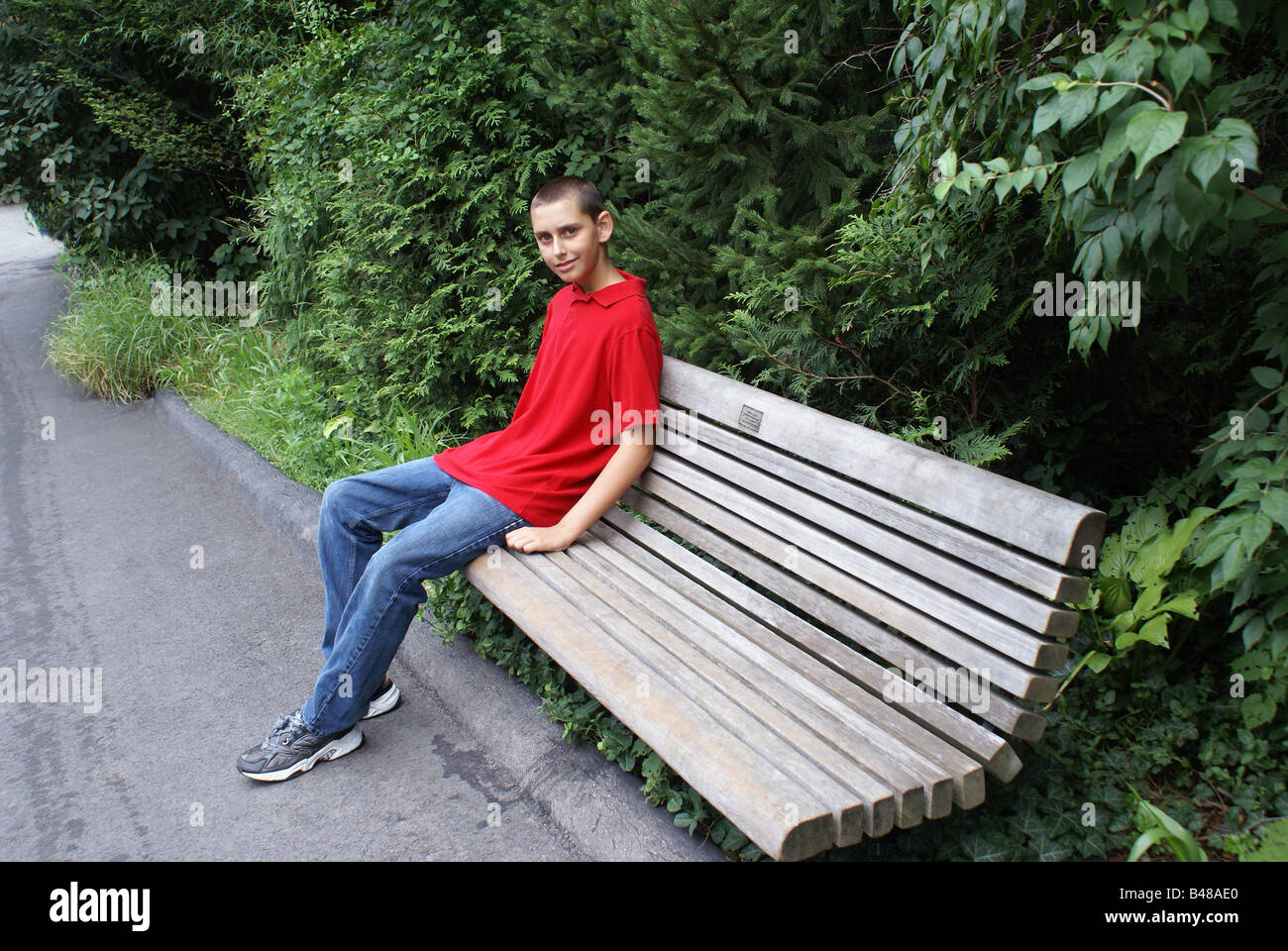 Sitting on a Bench Stock Photo - Alamy