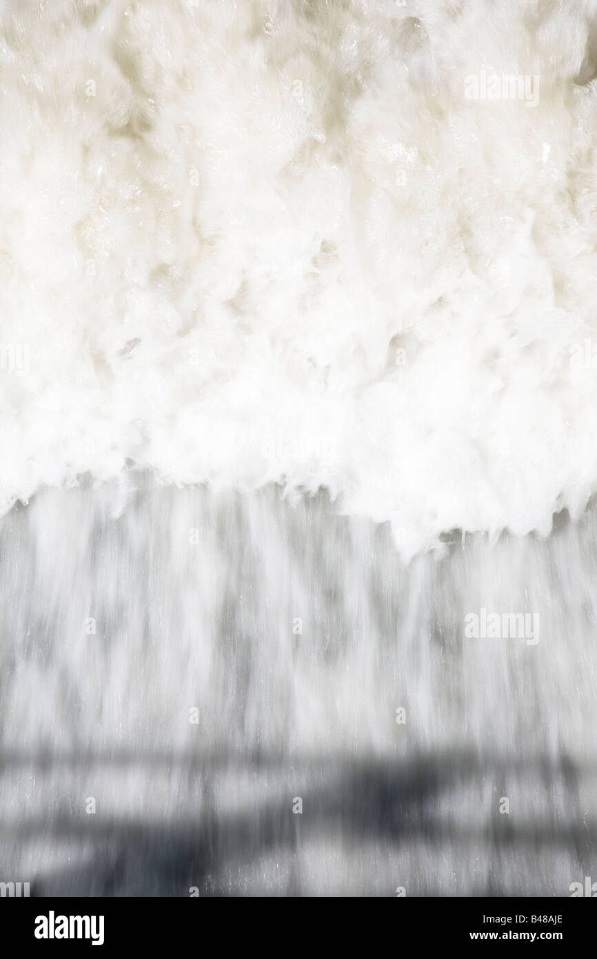 Flood water flowing over a weir, Guildford, Surrey, England Stock Photo ...