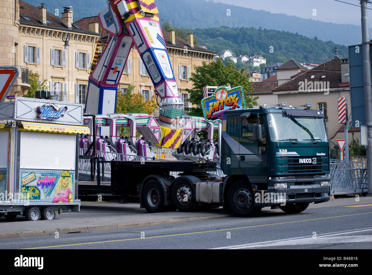 The carnival has arrived in town and one of the rides is setting up ...
