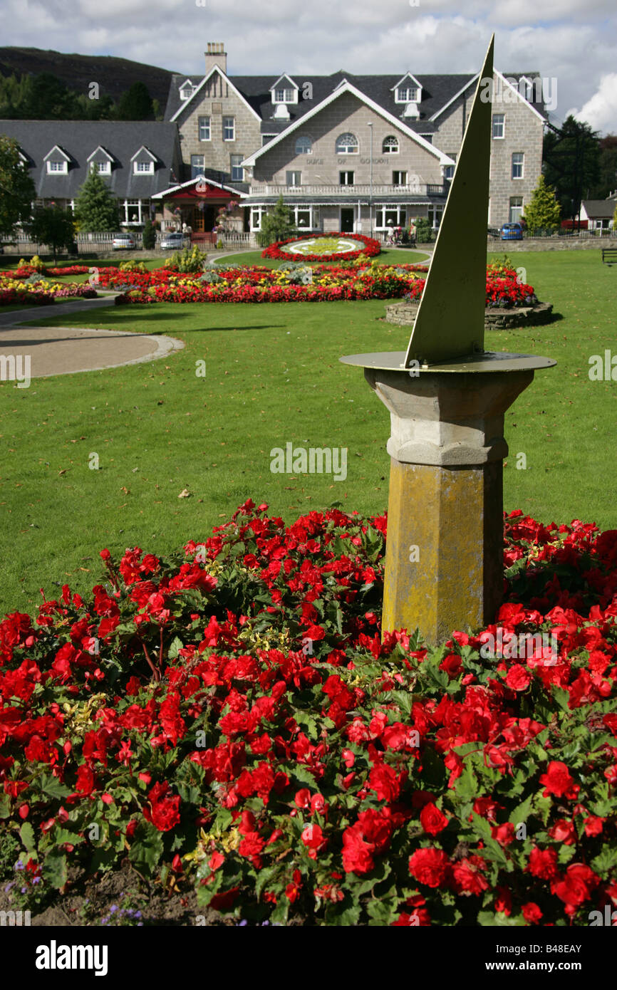 The Village of Kingussie, Scotland. Sun dial with the Kingussie public ...