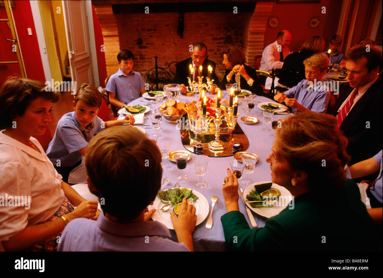 Teacher and pupils eating supper Stock Photo - Alamy