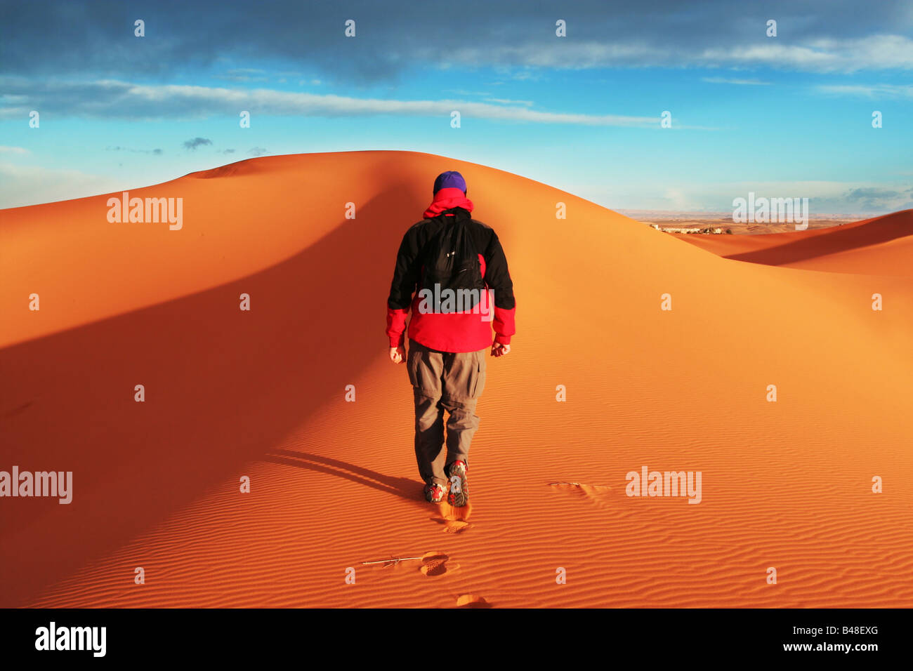 Men in sand desert Stock Photo - Alamy