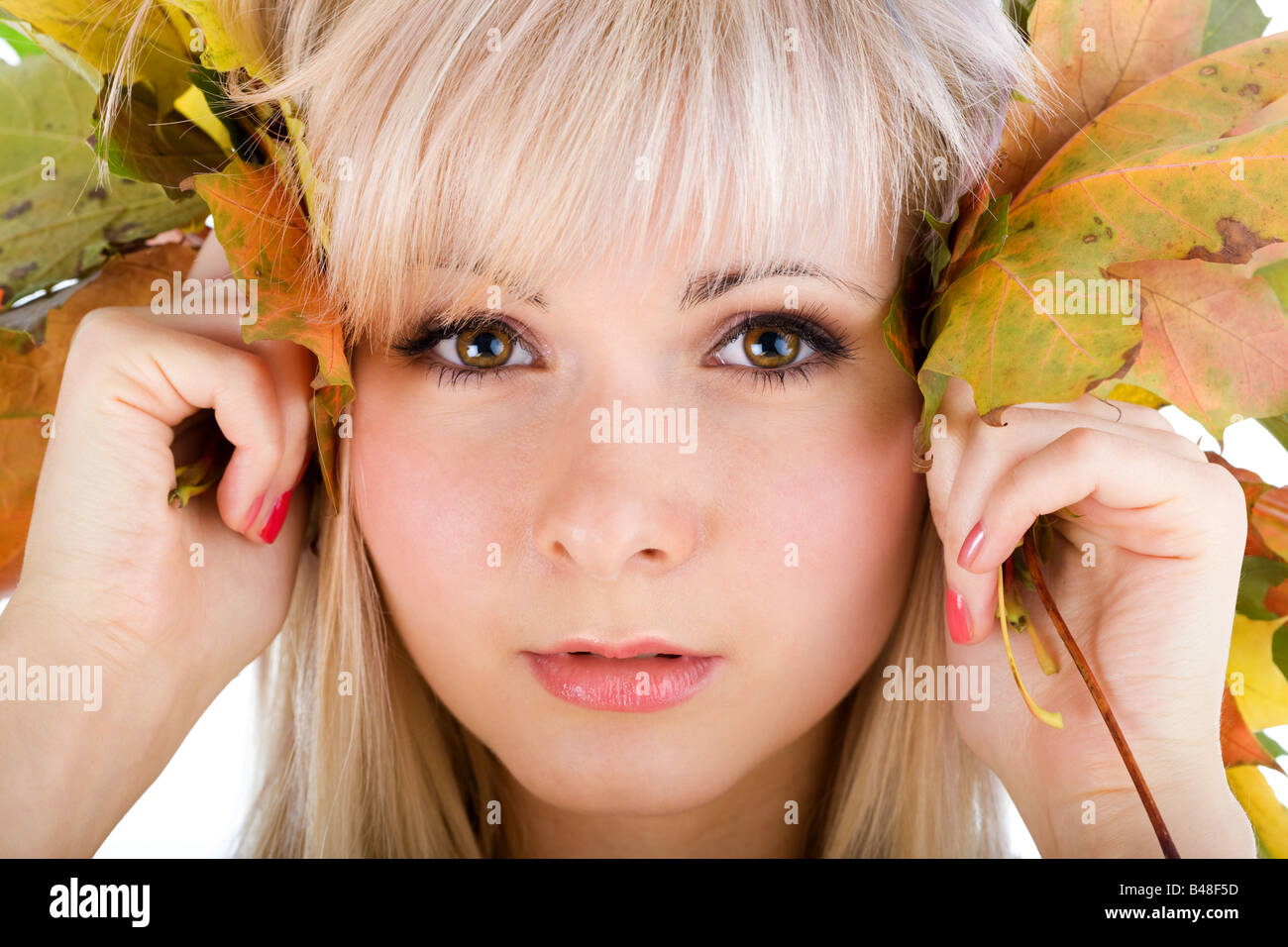 Close up of young woman face with foliage Stock Photo - Alamy