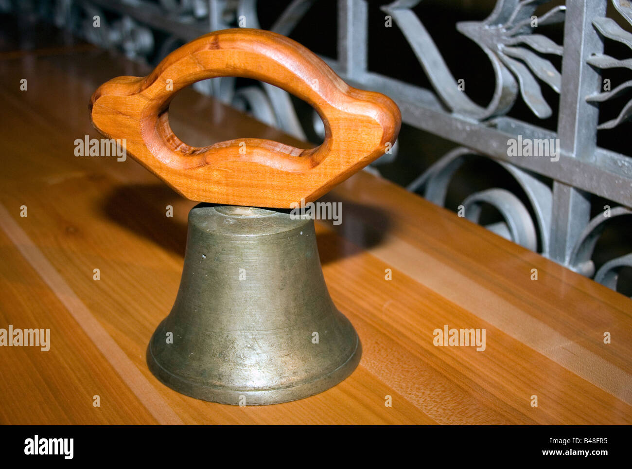 Small hand church bell on bench Stock Photo - Alamy