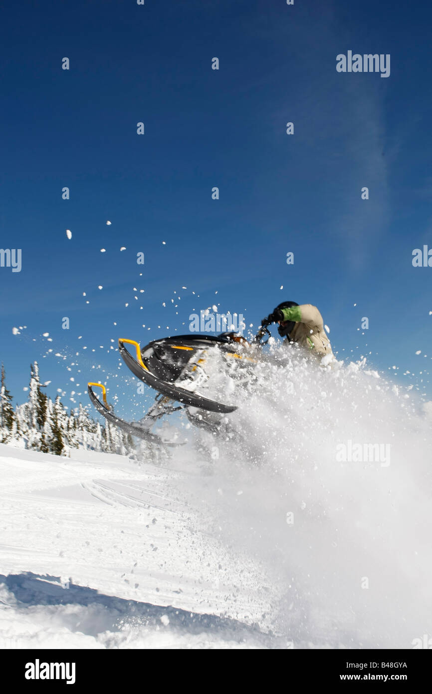 jumping a snowmobile catching big air Stock Photo - Alamy