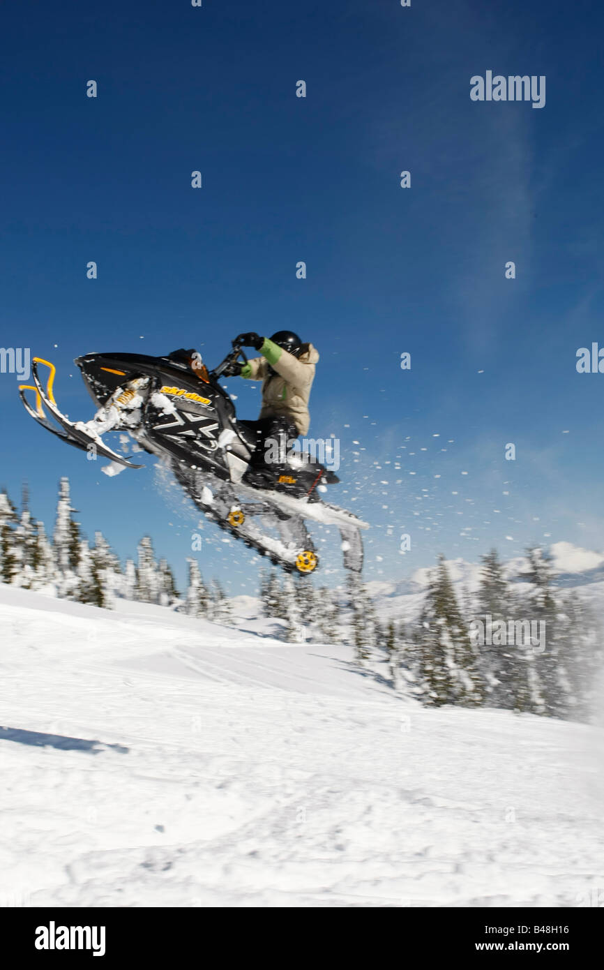 jumping a snowmobile catching big air Stock Photo - Alamy