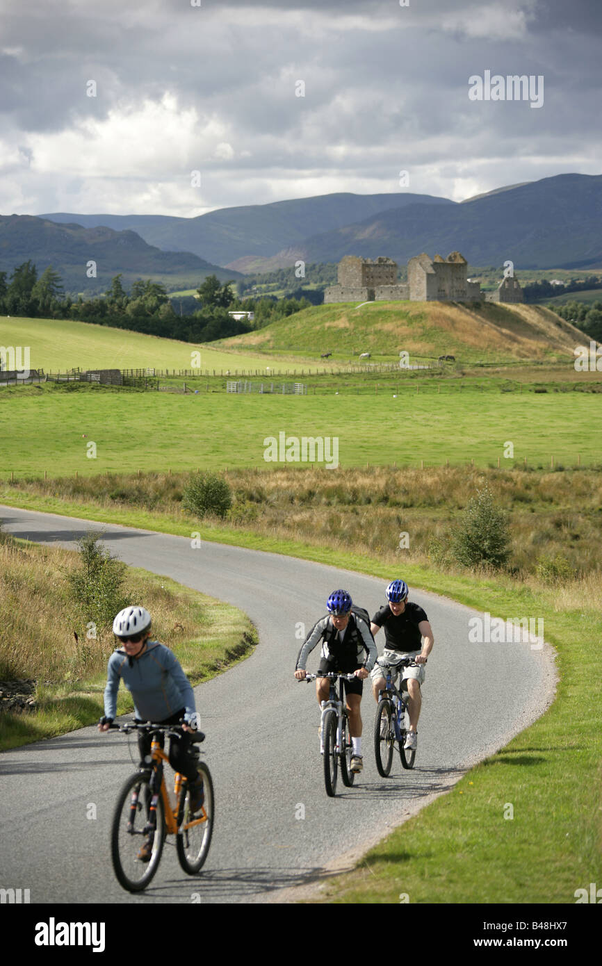 The Village of Kingussie, Scotland. Cyclists on the B970 heading north ...