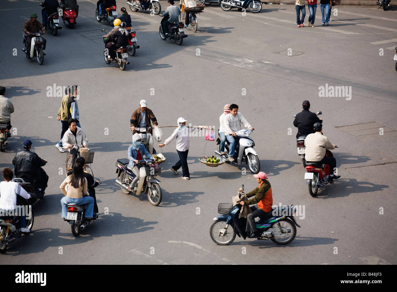 Chaotic traffic at a busy intersection in the Old Quarter Hanoi Vietnam ...