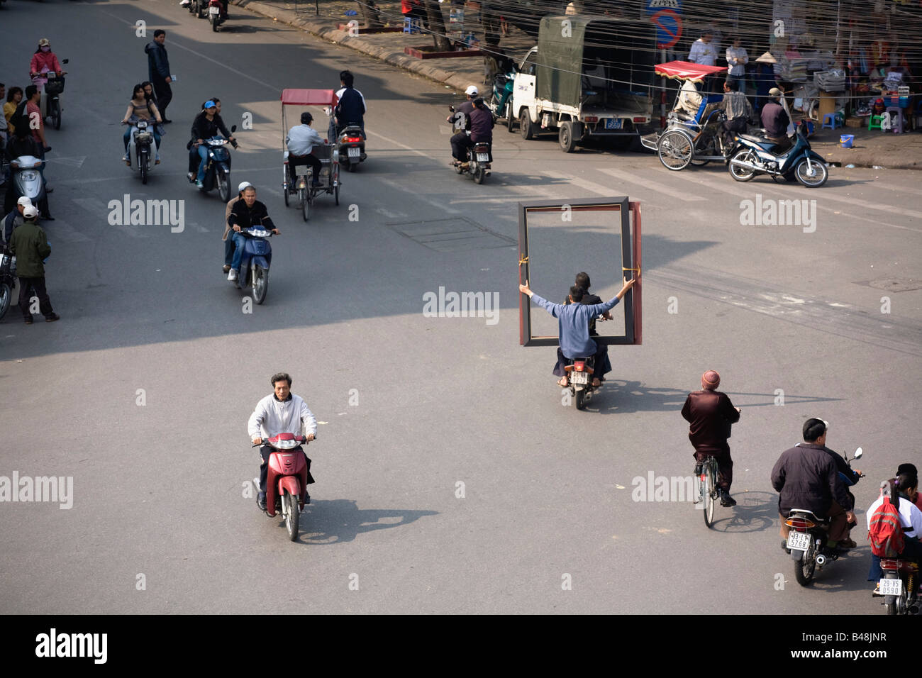 Chaotic traffic at a busy intersection in the Old Quarter Hanoi Vietnam ...
