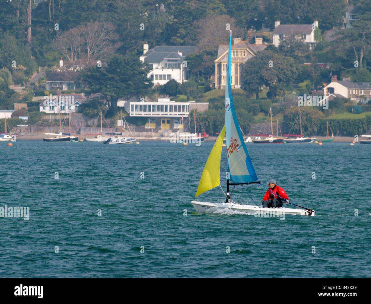 Man sailing a laser dinghy on the River Camel Estuary, Cornwall Stock ...