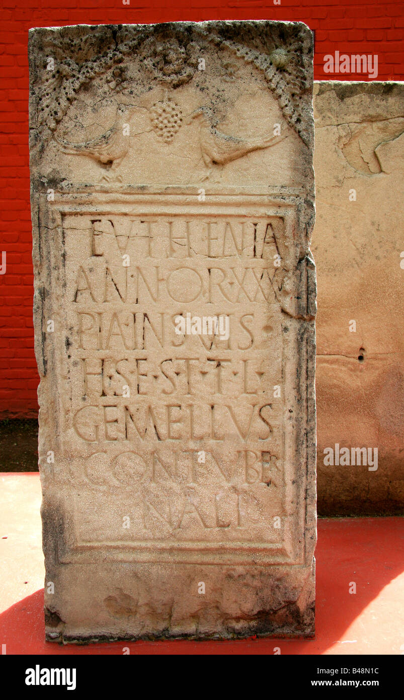 Roman Gravestone - in front of a red wall Stock Photo - Alamy