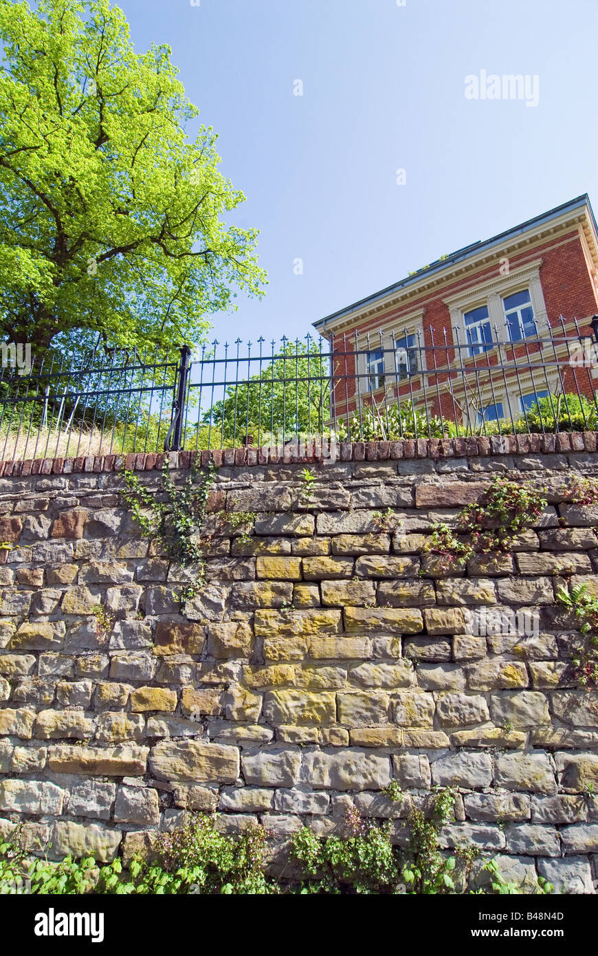 old stone wall house and tree in Essen Werden Germany Stock Photo - Alamy
