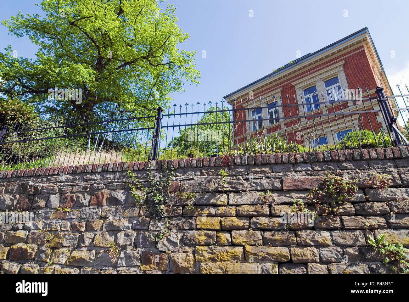 old stone wall house and tree in Essen Werden Germany Stock Photo - Alamy