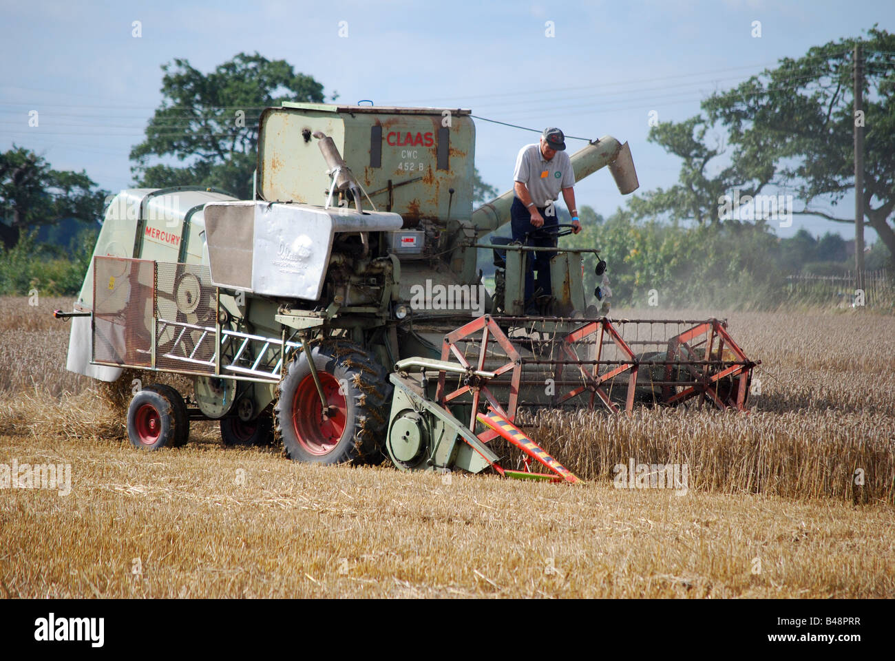 Cleaning agricultural field harvester hi-res stock photography and ...