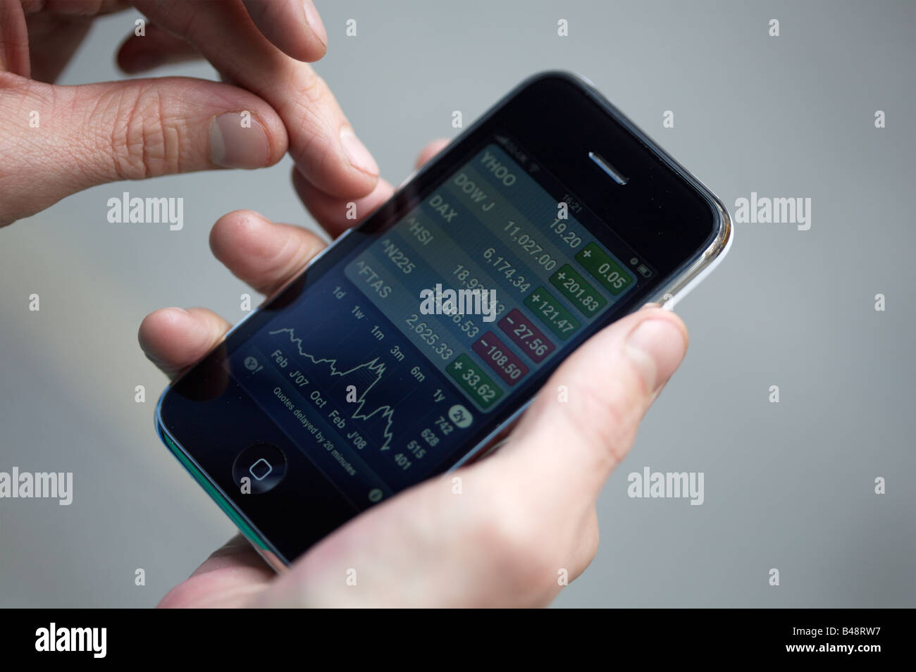 Using an Apple i phone Stock Photo - Alamy