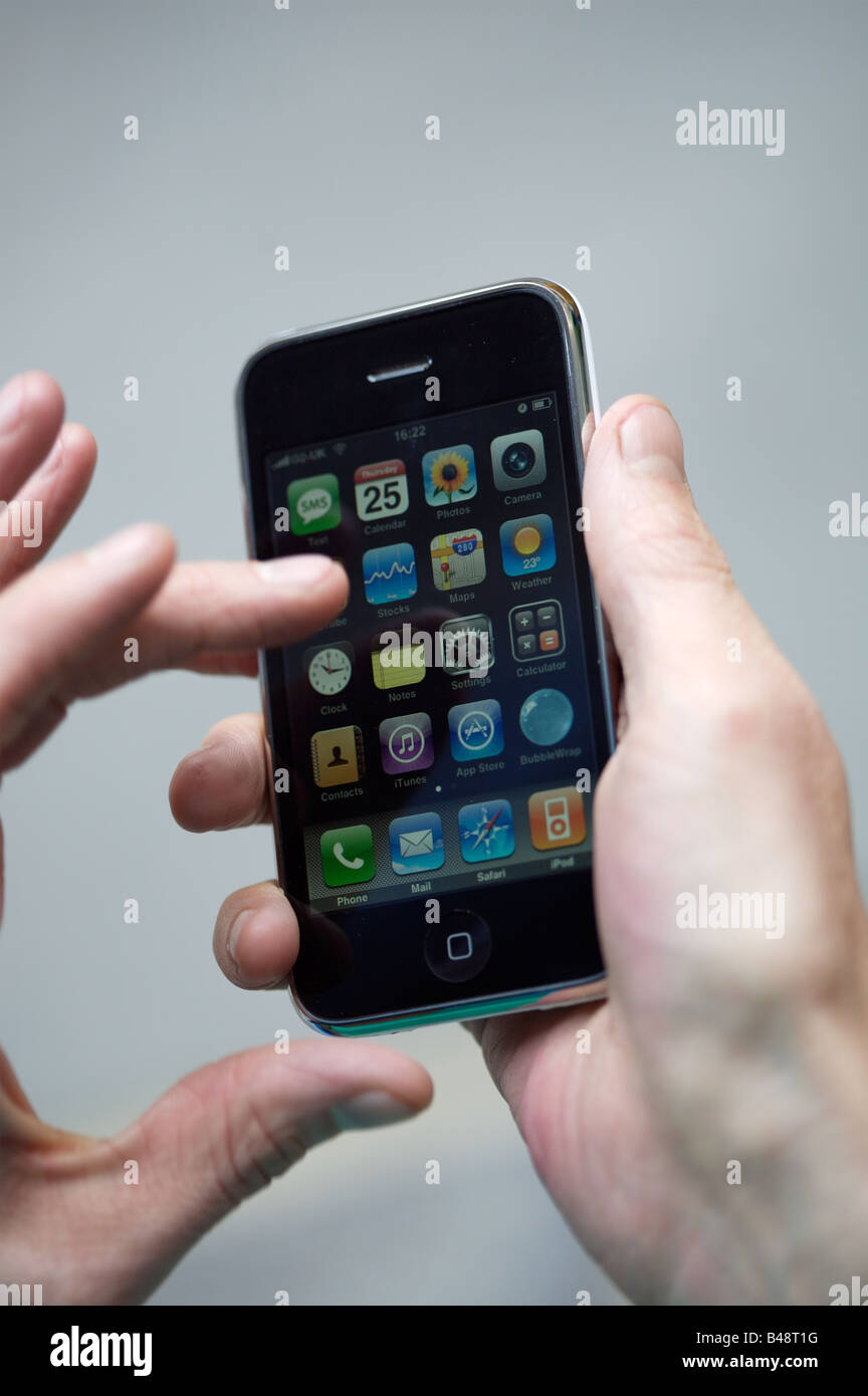 Using an Apple i phone Stock Photo - Alamy