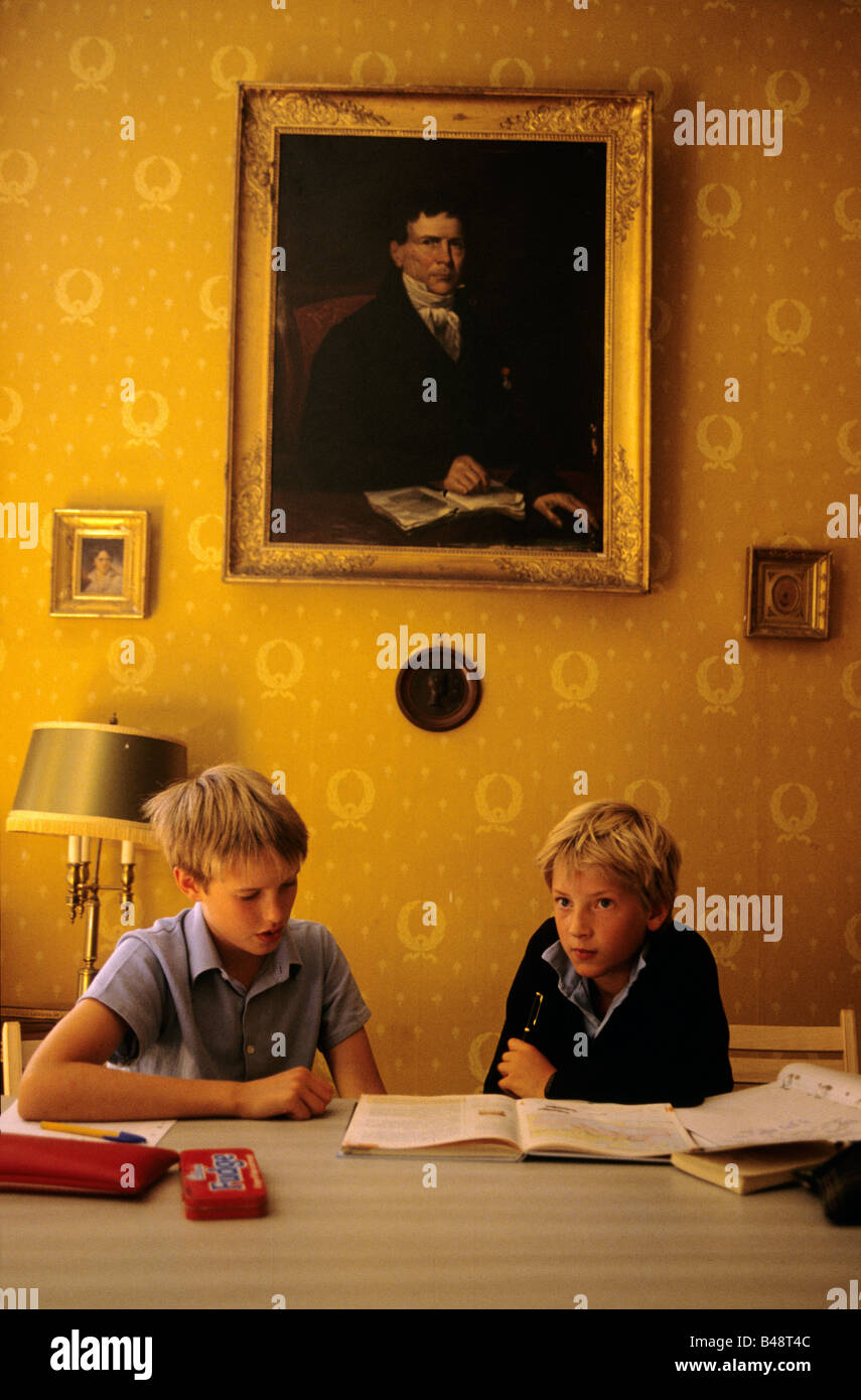 Boys reading book Stock Photo - Alamy