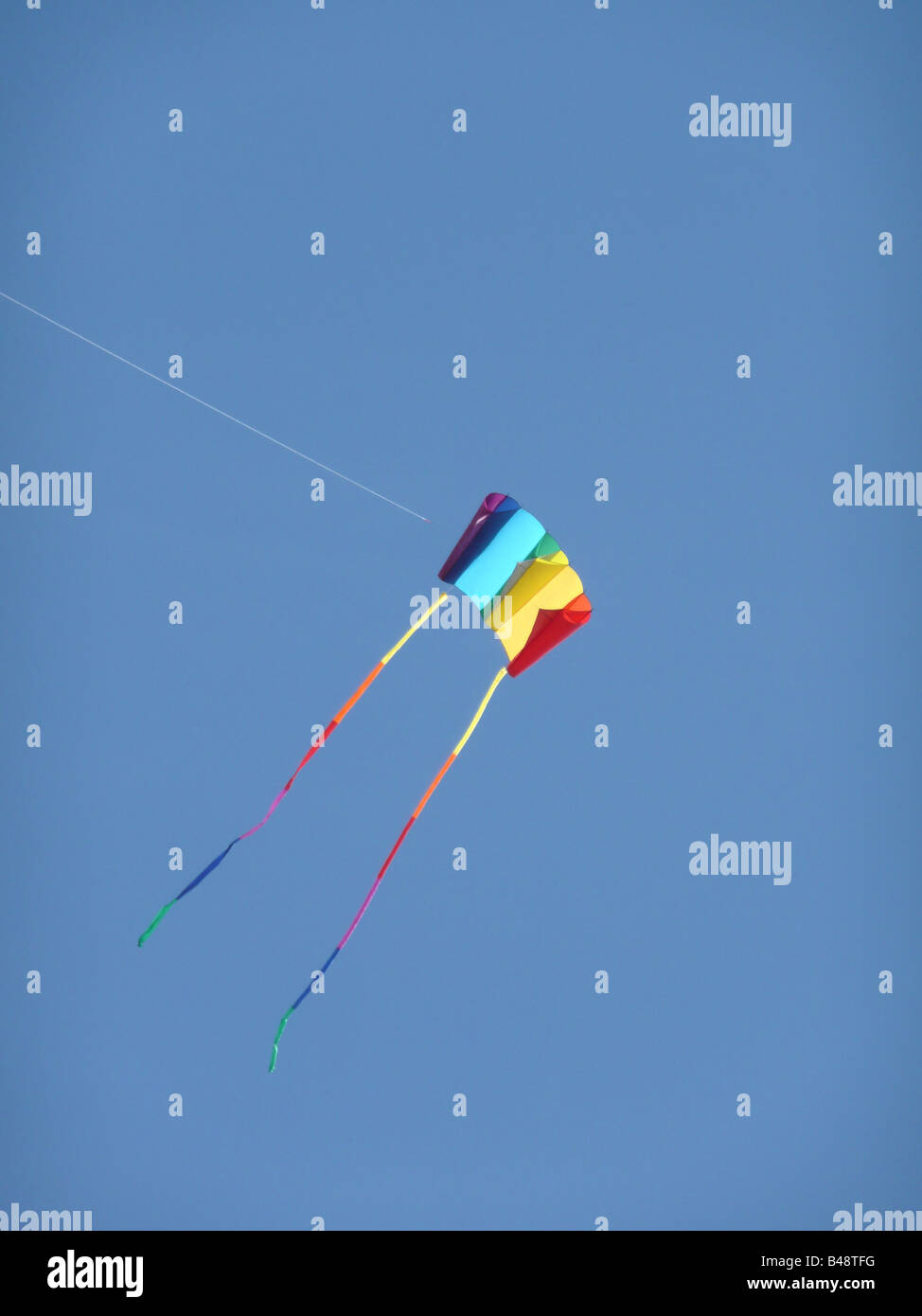 Single kite, strings, blue, sky Stock Photo - Alamy