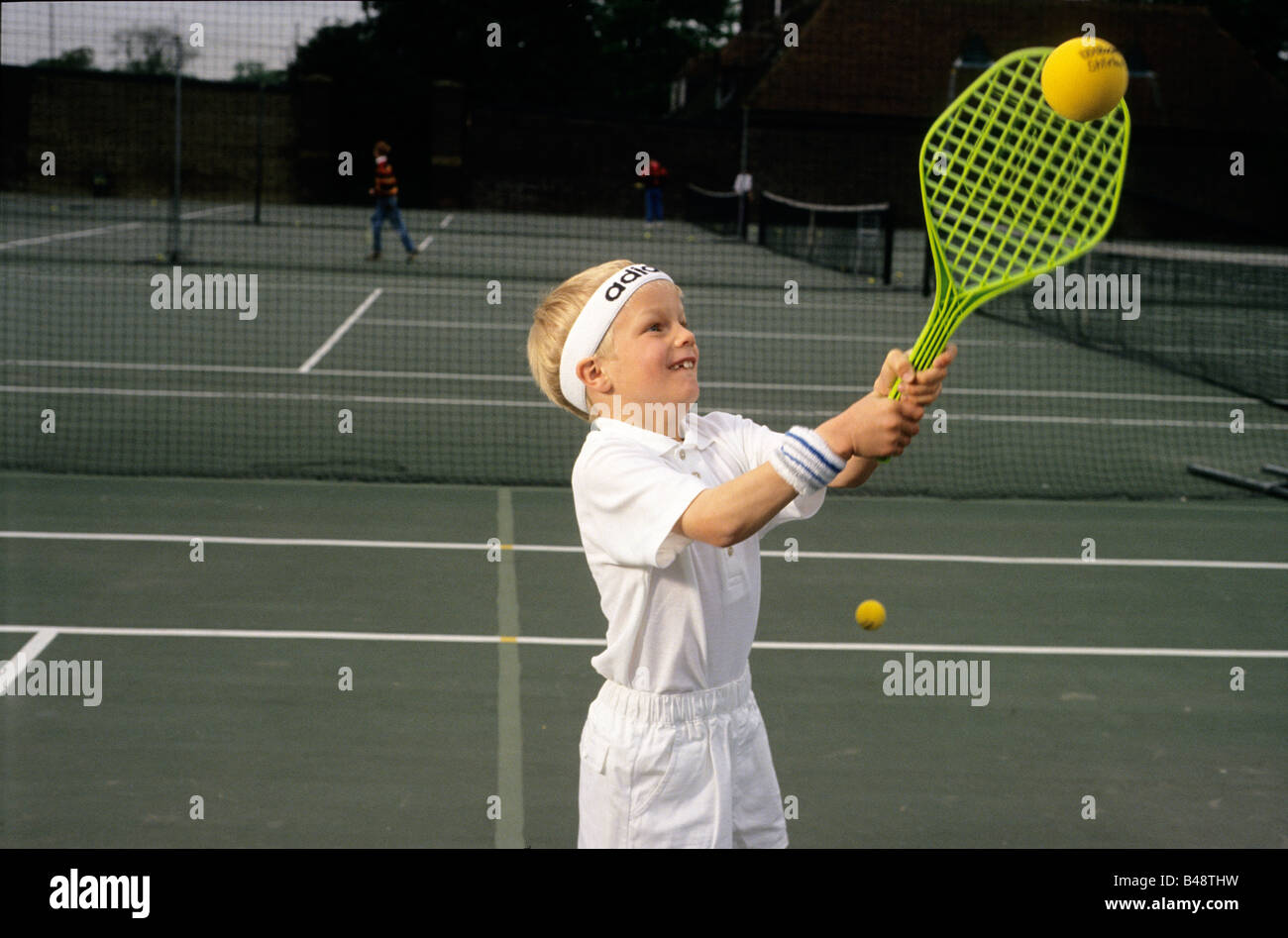 Play tennis boy hi-res stock photography and images - Alamy