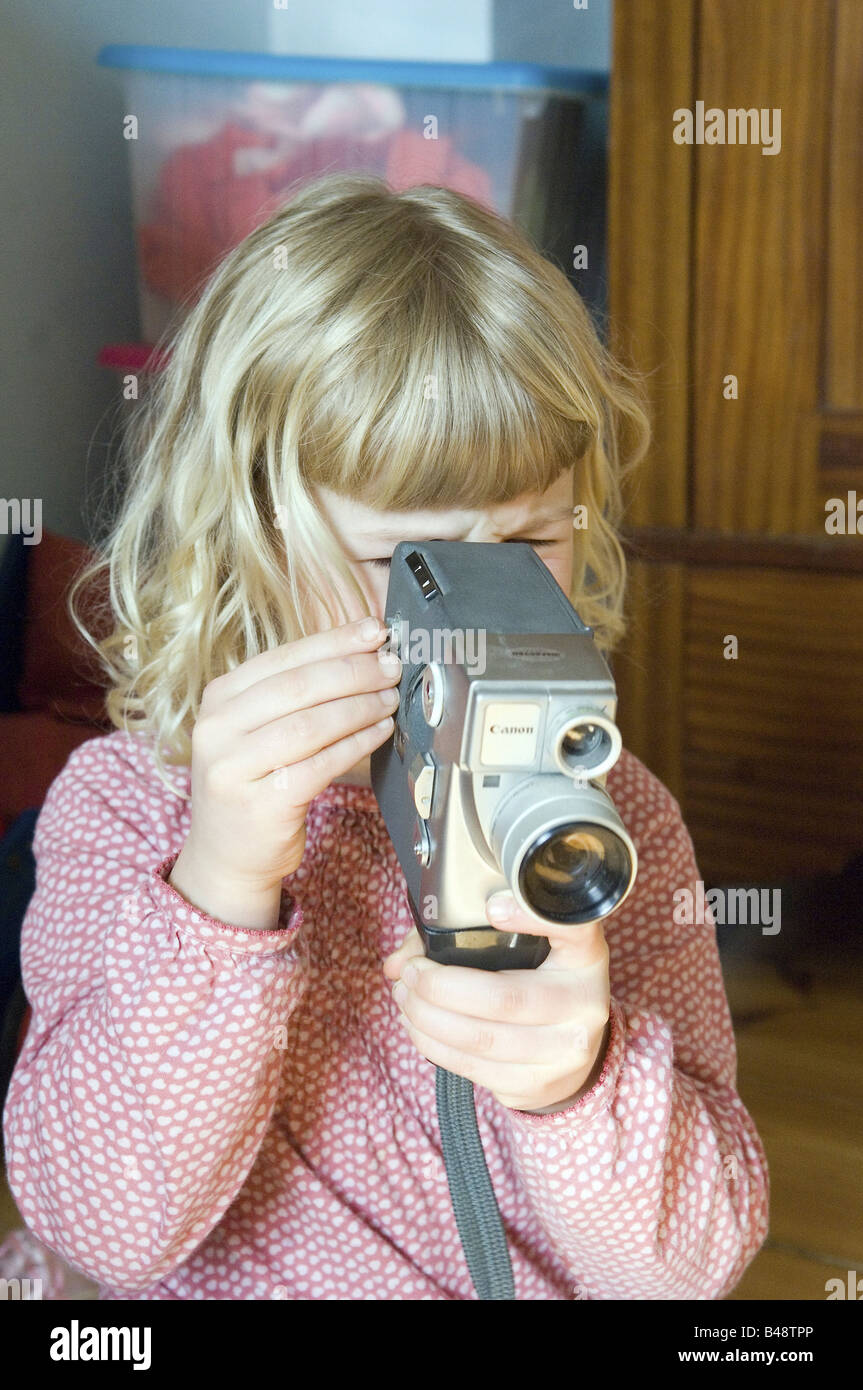 Little girl holding a video camera Stock Photo - Alamy