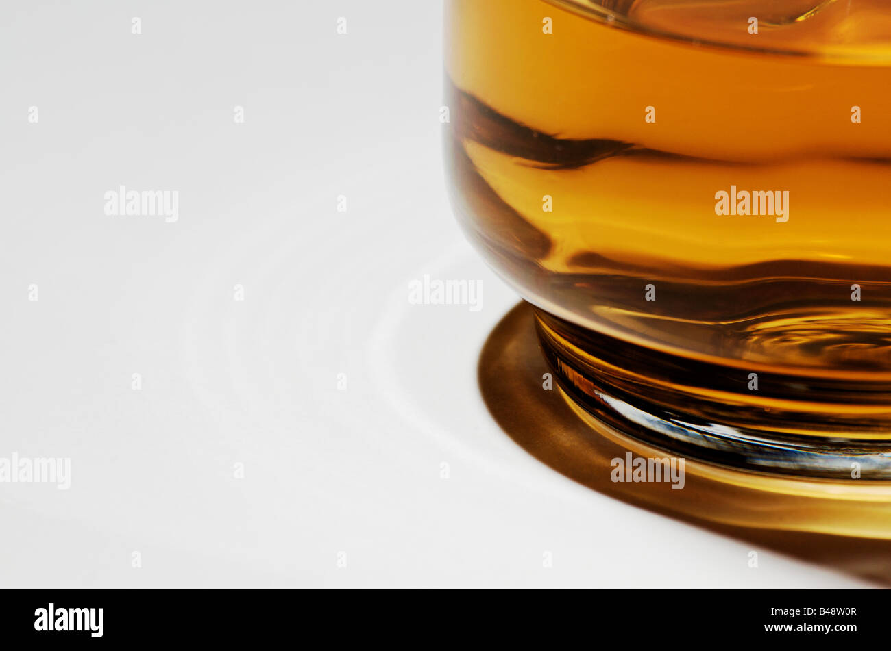 whisky glass on a white background Stock Photo - Alamy