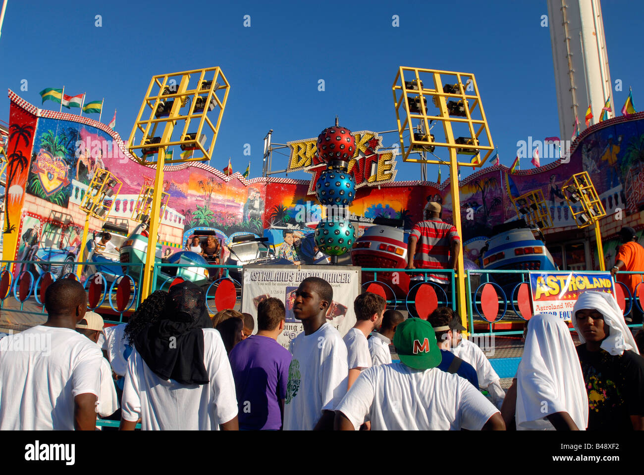 Crowds wait on queue to ride the Break Dance at Astroland in Coney ...