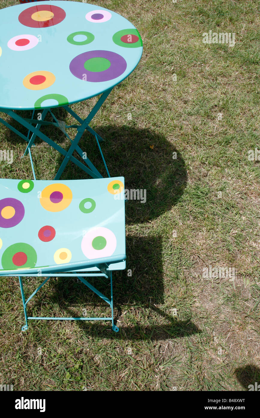 colorful garden table and chair in sun Stock Photo - Alamy