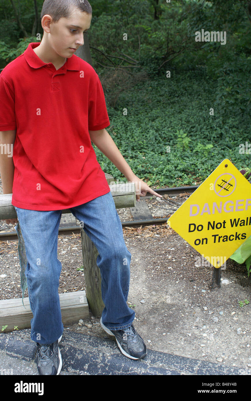 Pointing To Danger Sign Stock Photo - Alamy