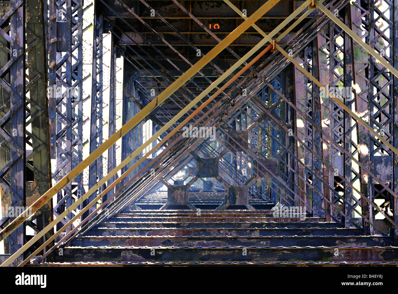 View loking through iron beams of highbridge cantilever railway bridge ...