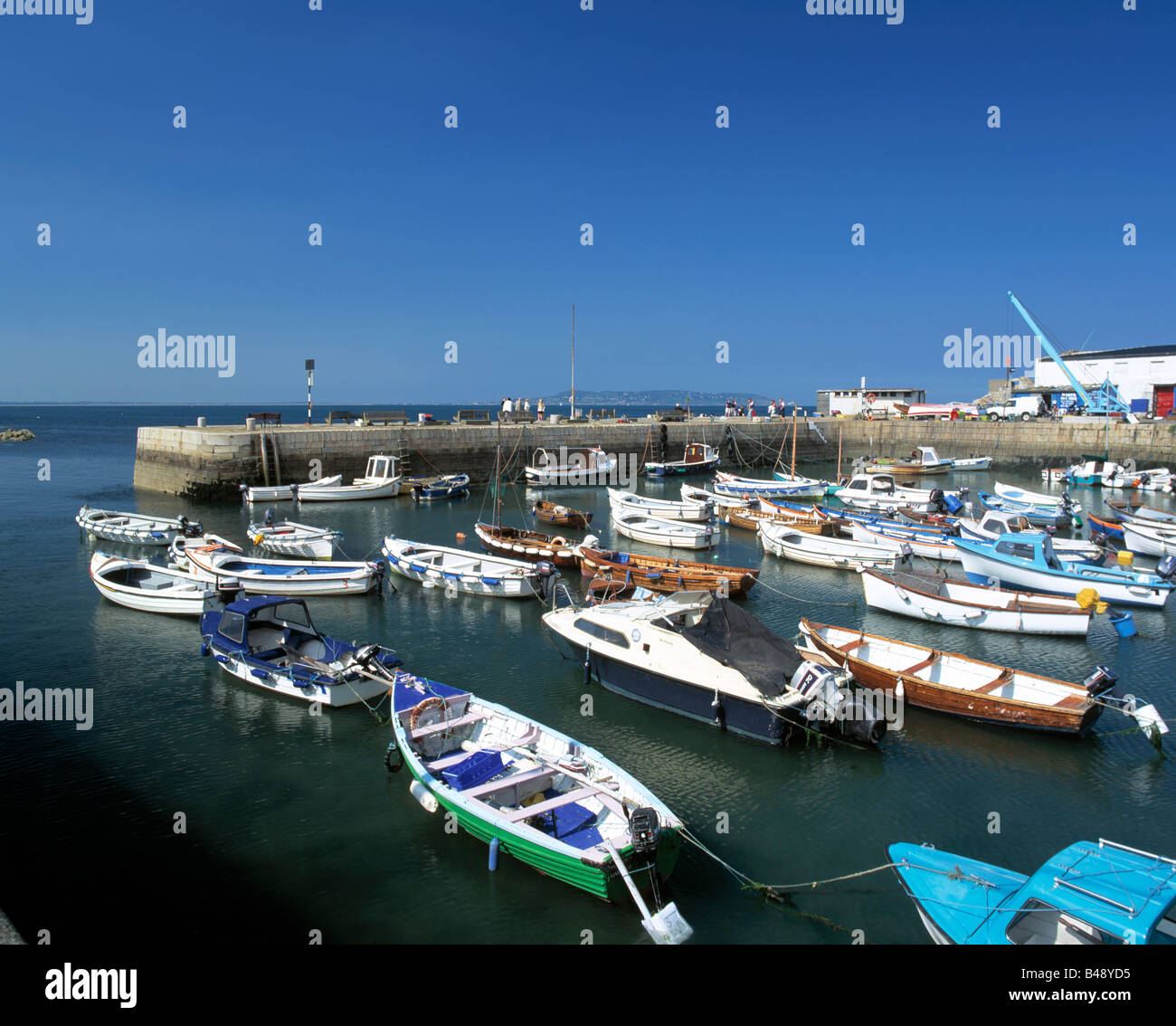 sheltered sea inlet on irelands east coast, boats anchored in harbor ...