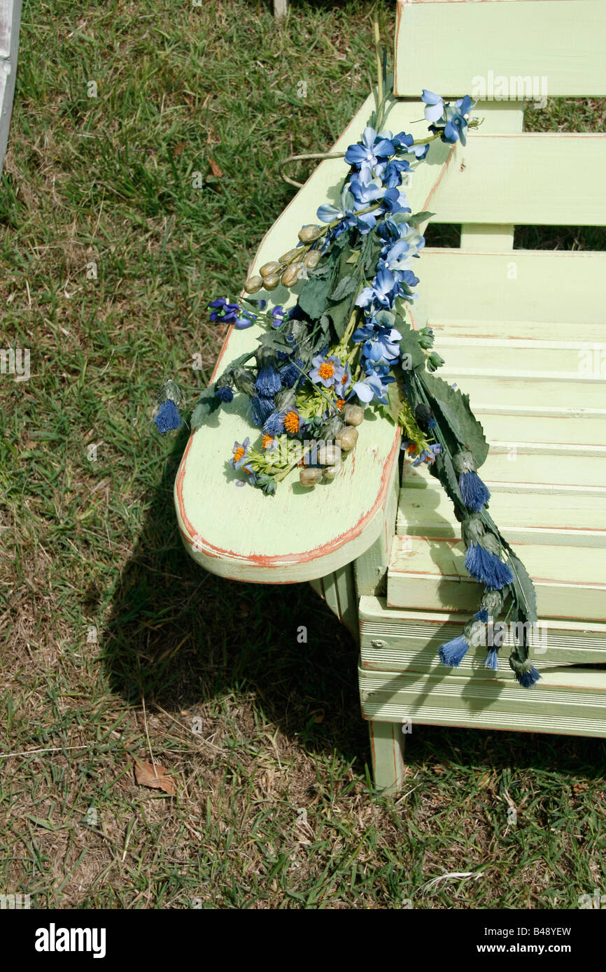 bunch of flowers on bench in park Stock Photo - Alamy