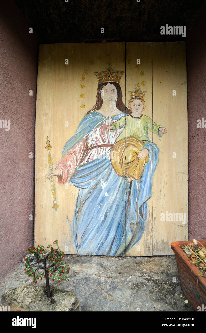 A crude Virgin Mary drawn in a wooden altar in Bellinzona, Tessin ...