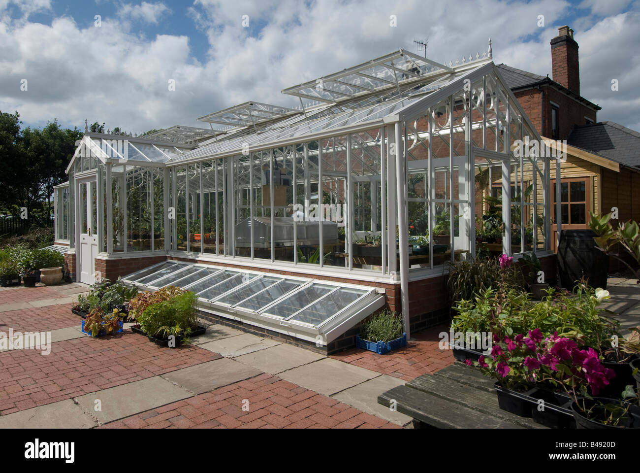 A traditional and classis styled victorian greenhouse and cold frames ...