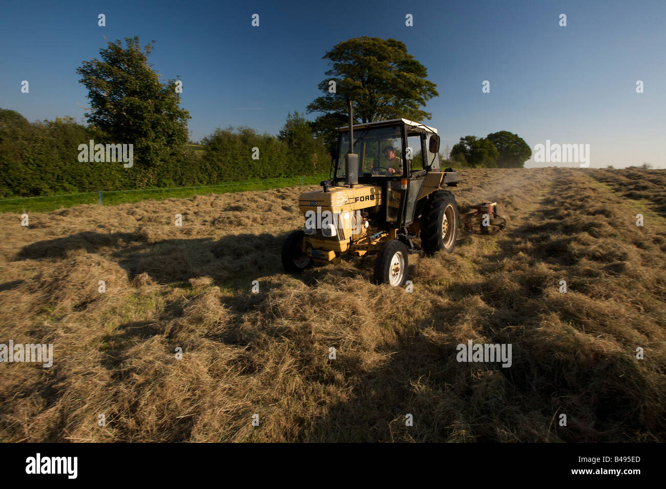 Harvest hay tractor hi-res stock photography and images - Alamy