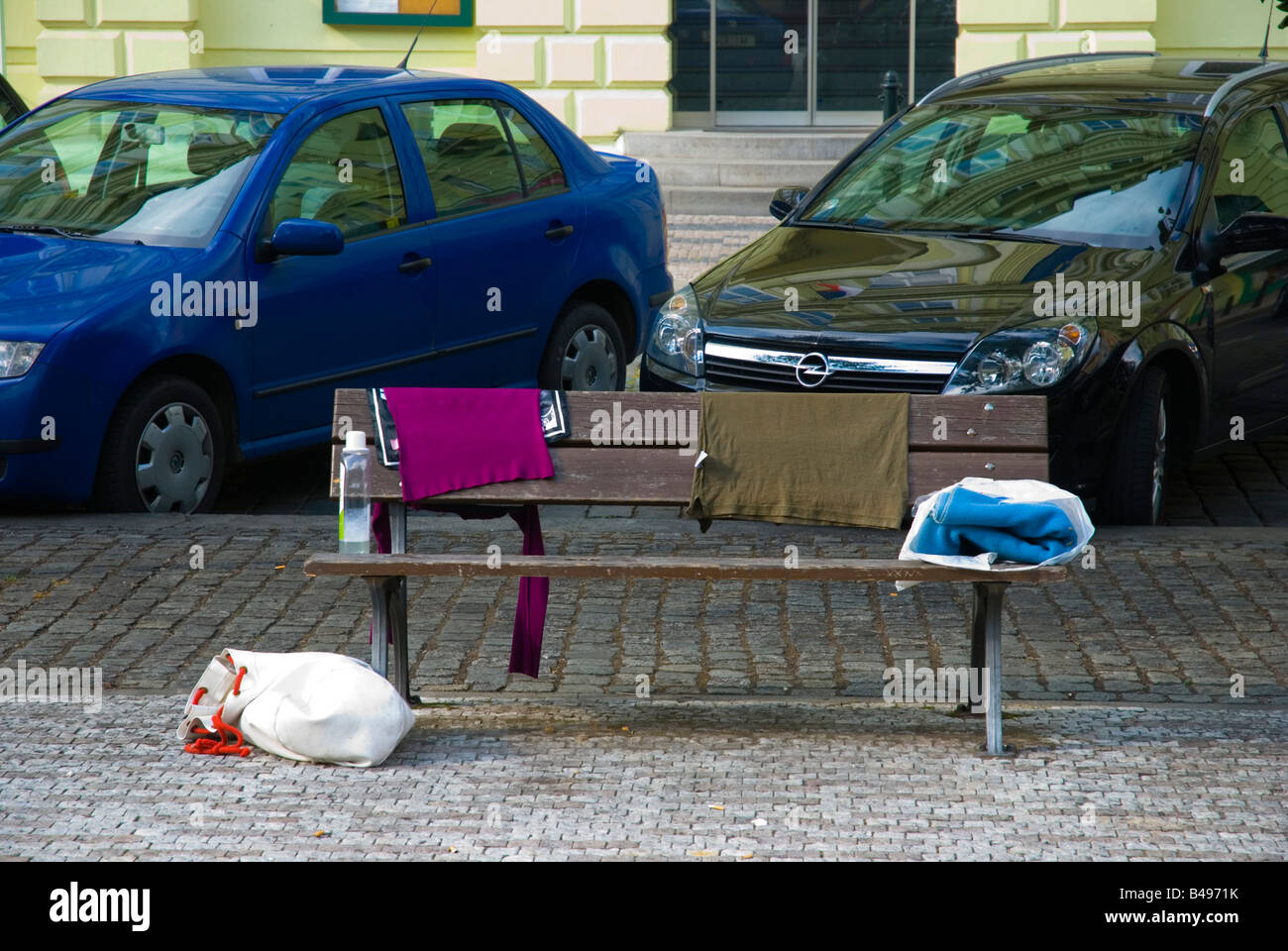 Park bench occupied by a homeless person at Senovazne namesti square in ...