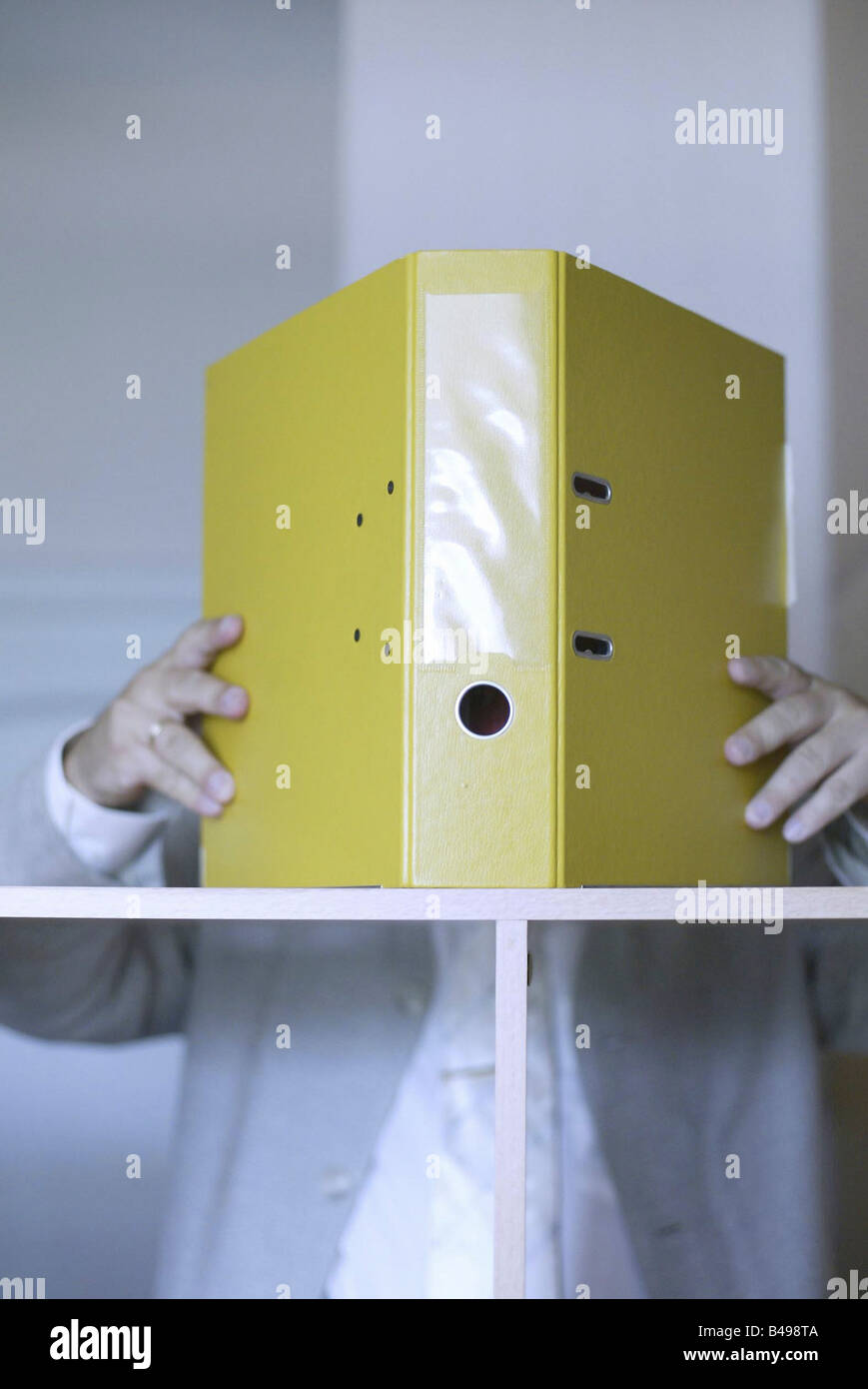 Man with a file binder Stock Photo - Alamy