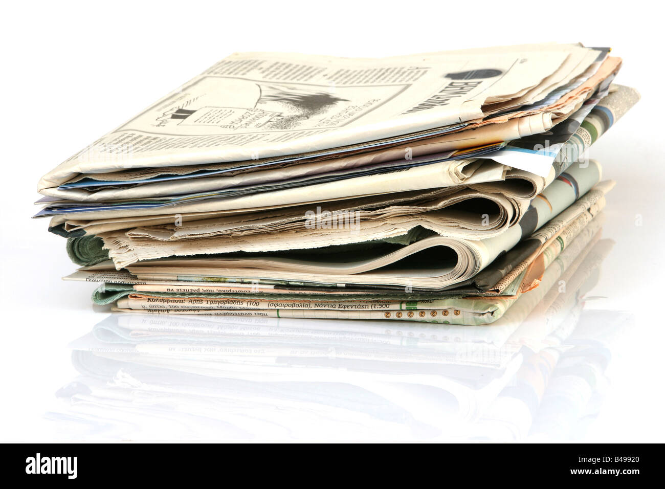 media concepts stack of newspapers with reflection isolated on white ...