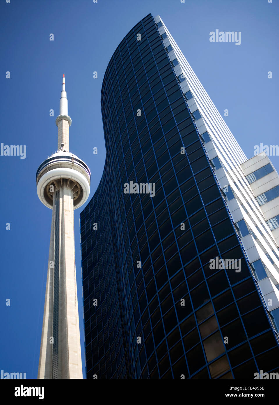 Toronto CN tower and Curved building, Ontario, Canada Stock Photo - Alamy