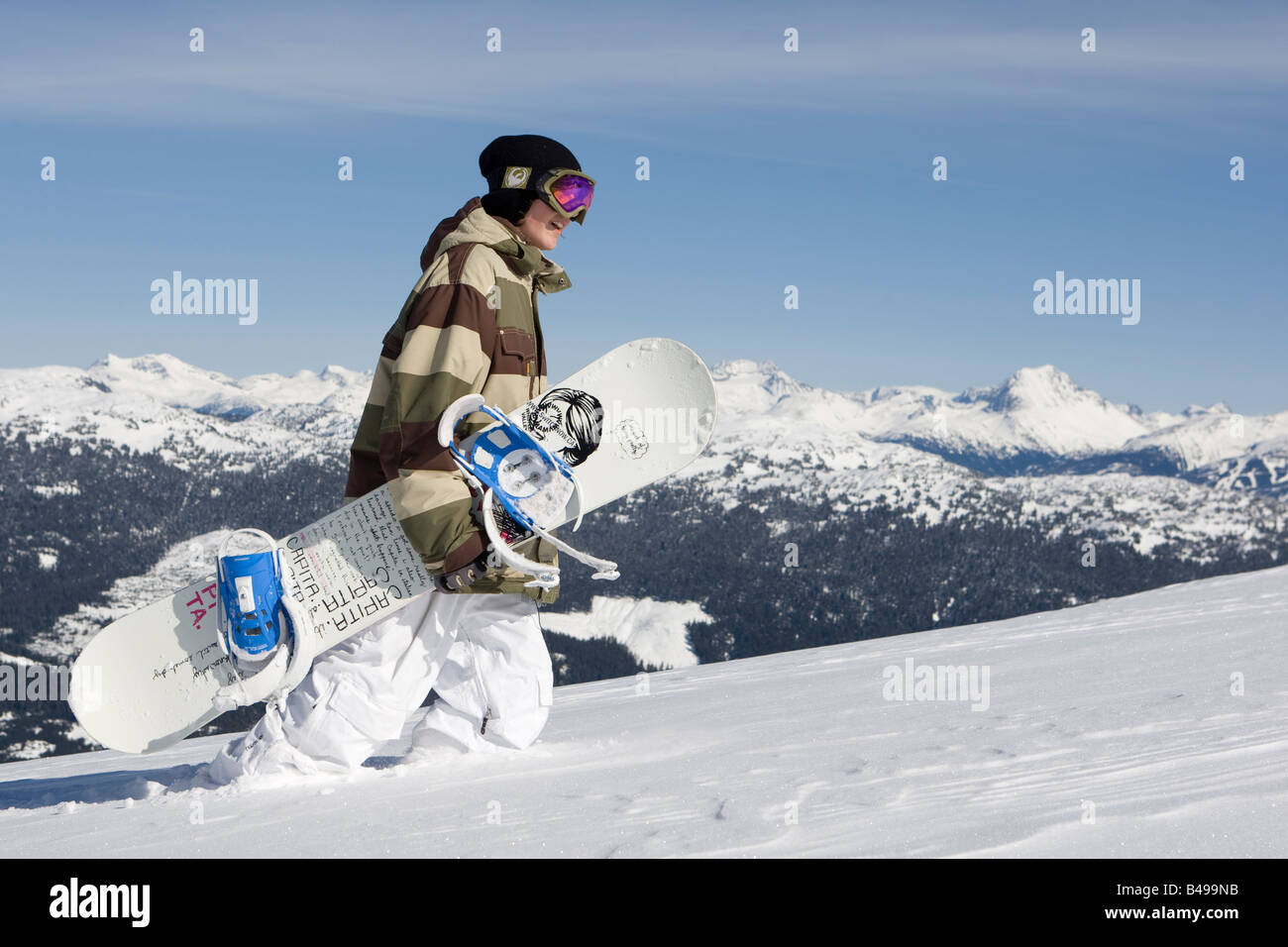 snowboarder walking in deep snow in Whistler BC Stock Photo - Alamy