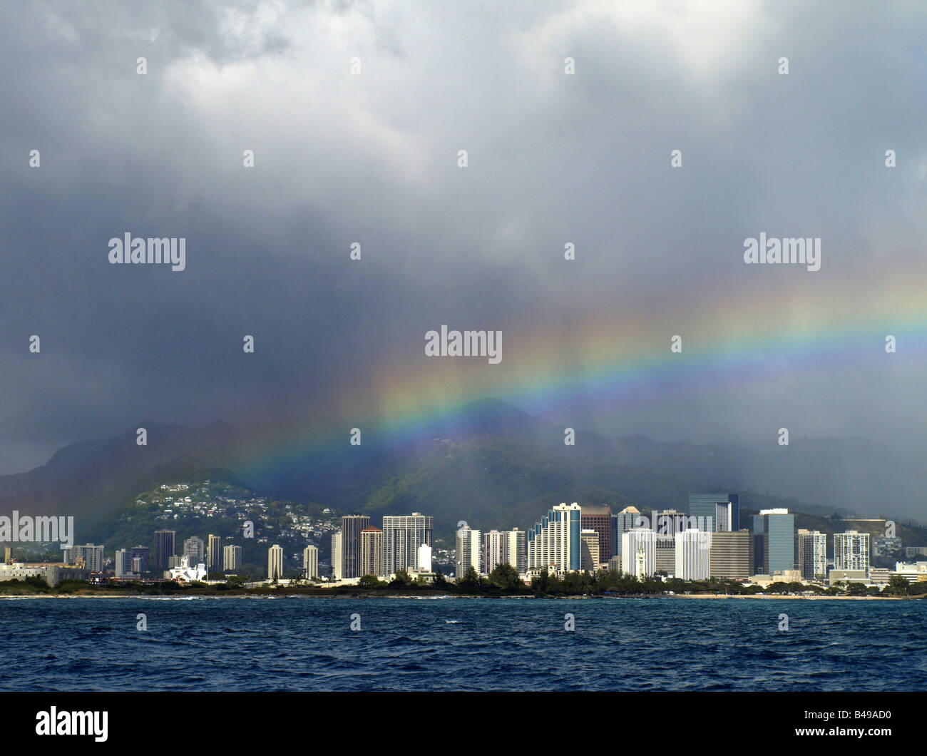 Rainbow over the Honolulu harbor area Stock Photo - Alamy