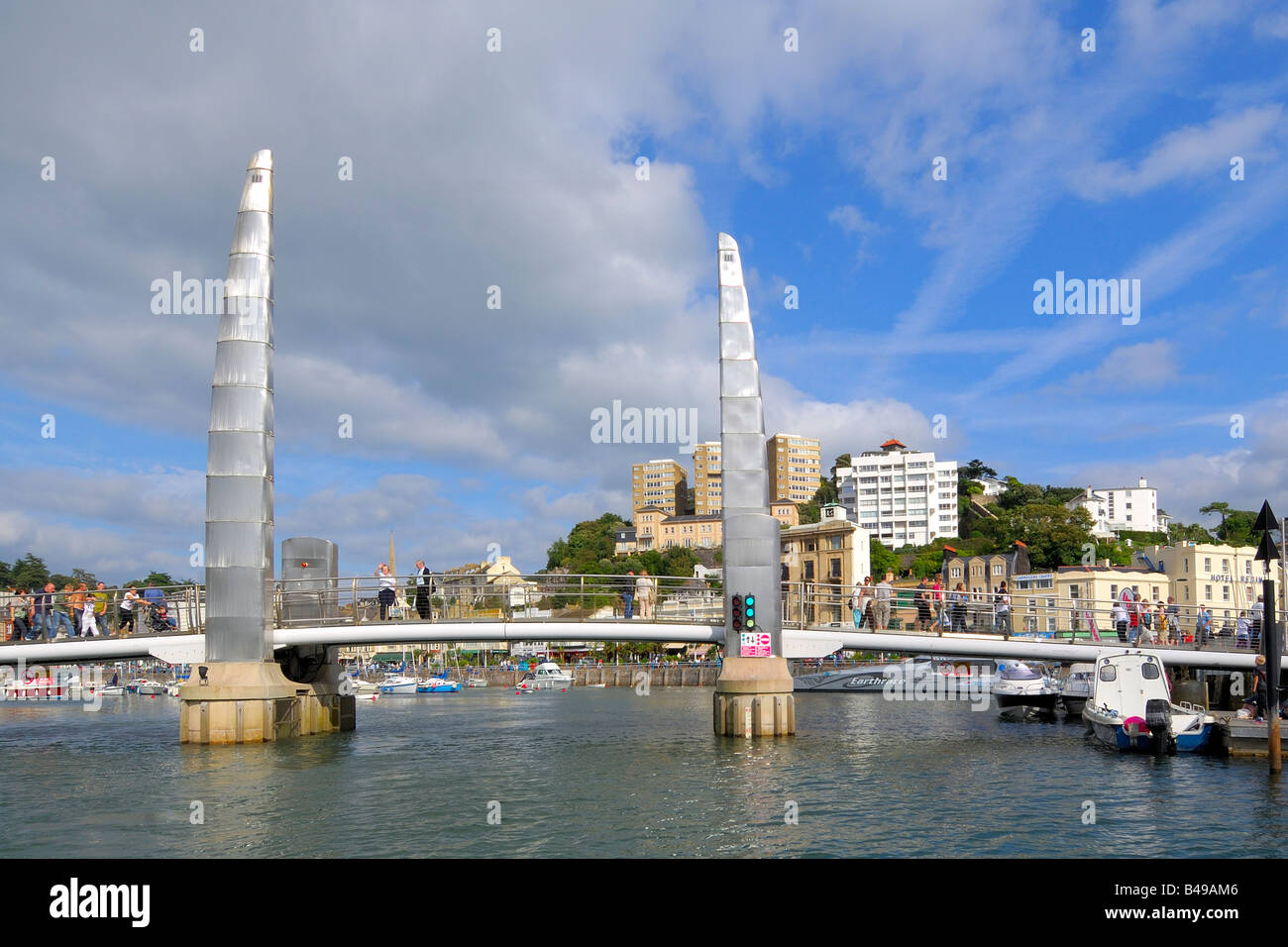 The footbridge across the entrance to the inner harbour in Torquay on a ...