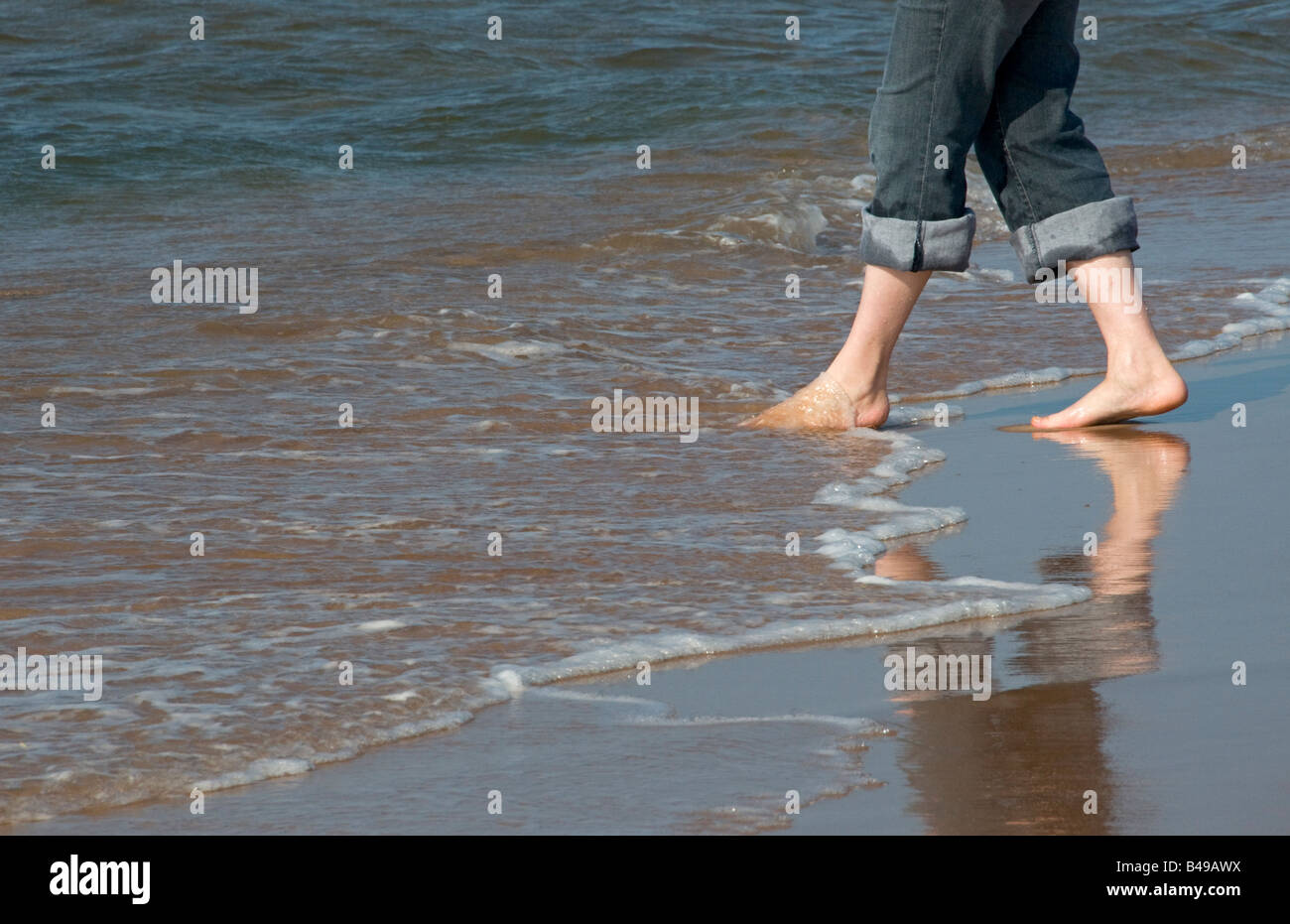 Feet in the ocean Stock Photo - Alamy