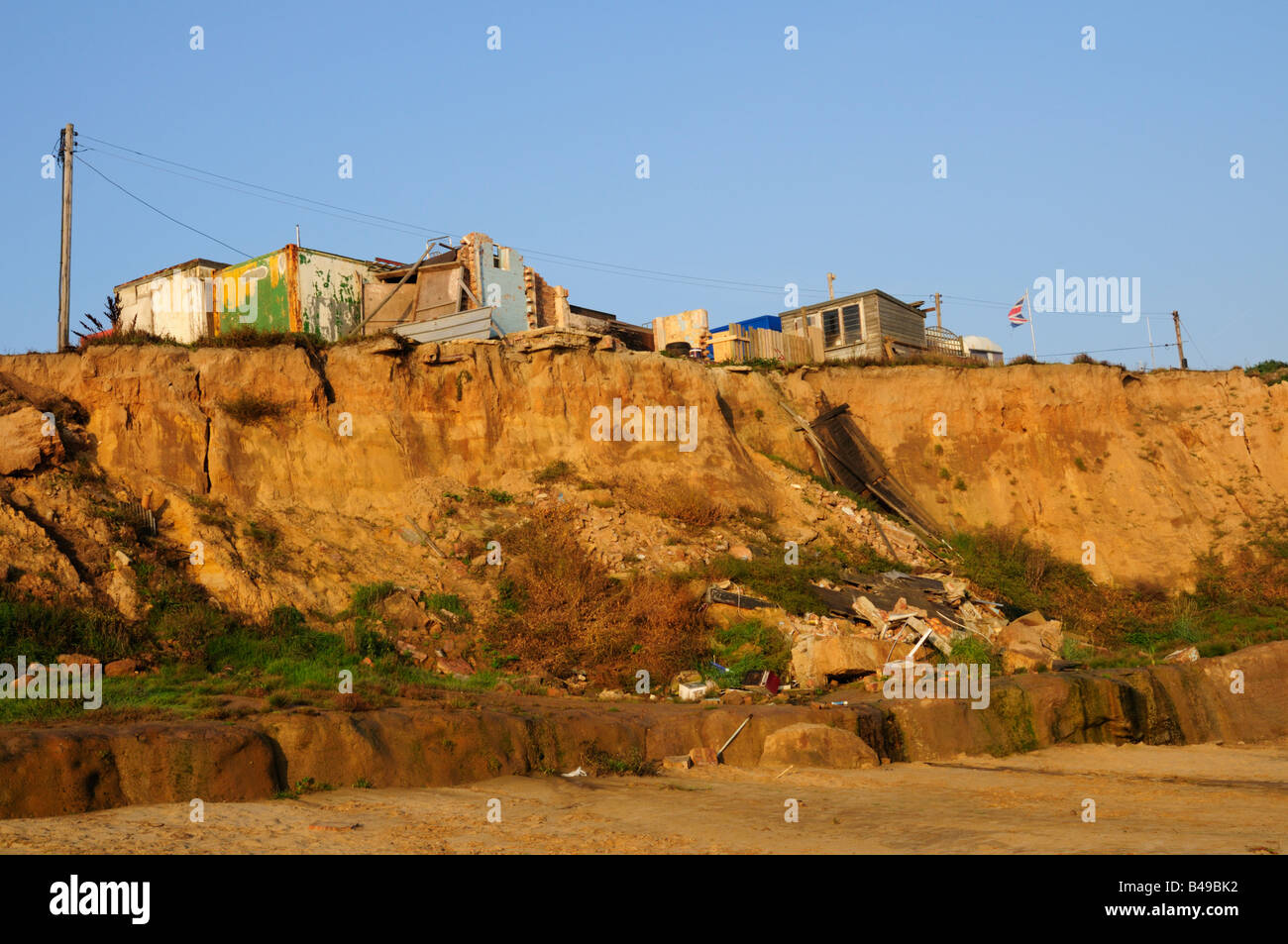 Buildings on the Cliff edge at Happisburgh Norfolk England UK Stock ...