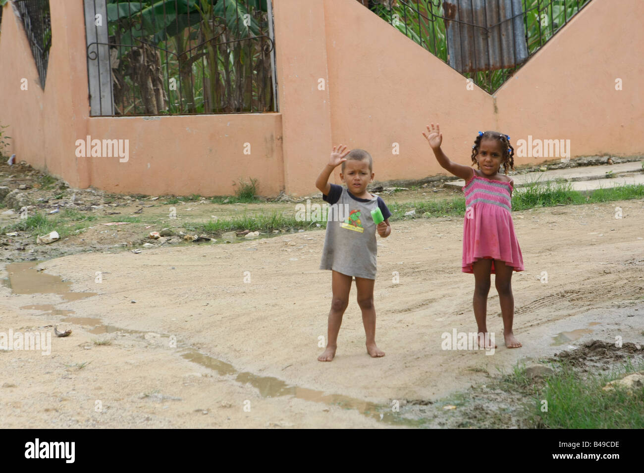 Dominican kids waving to the tourists Stock Photo - Alamy